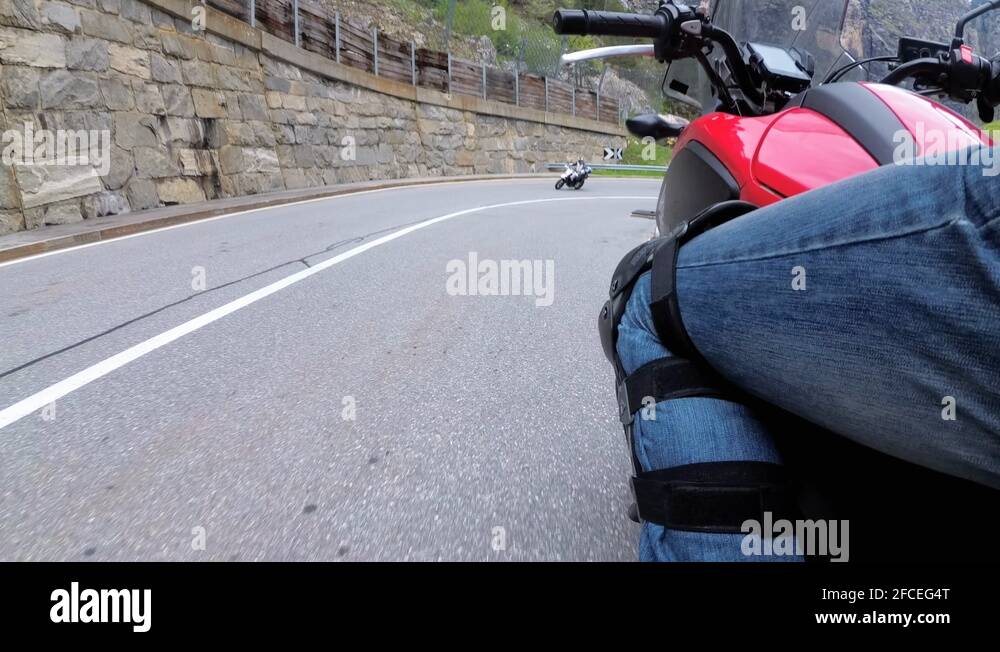 Motorcyclist Rides along on the Scenic Mountain Curve Road. Side view ...