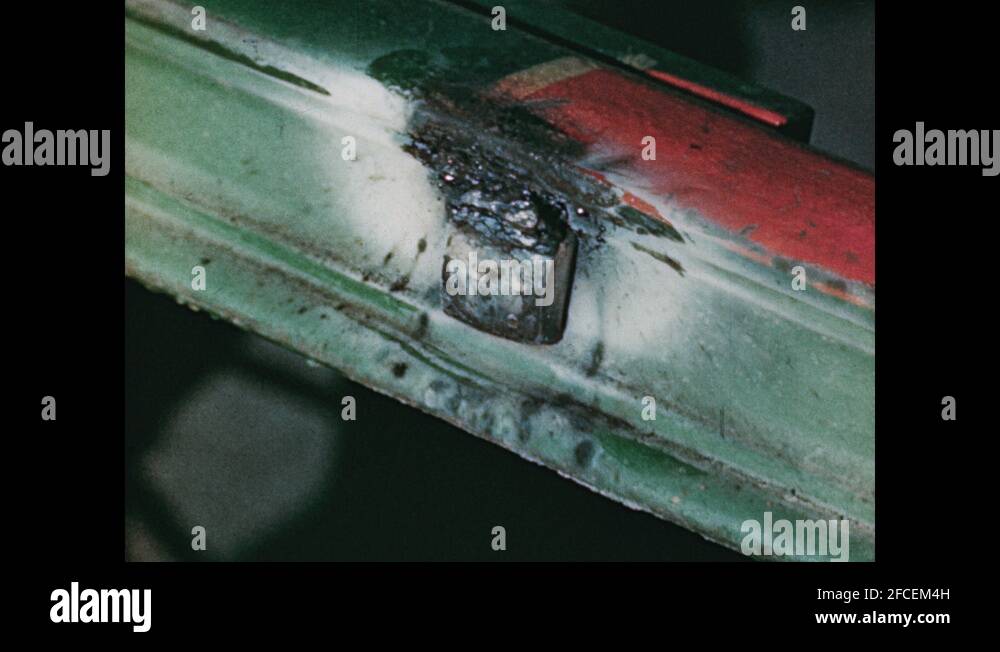 1940s: UNITED STATES: welding on plough. Cylinder block on tractor ...