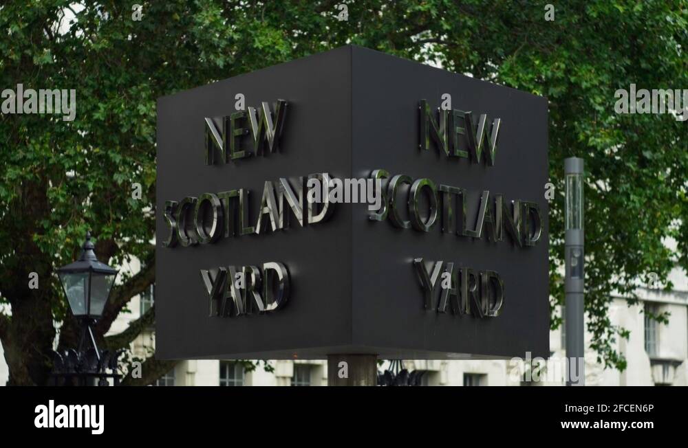 Close-up footage of the New Scotland Yard sign of the Metropolitan ...