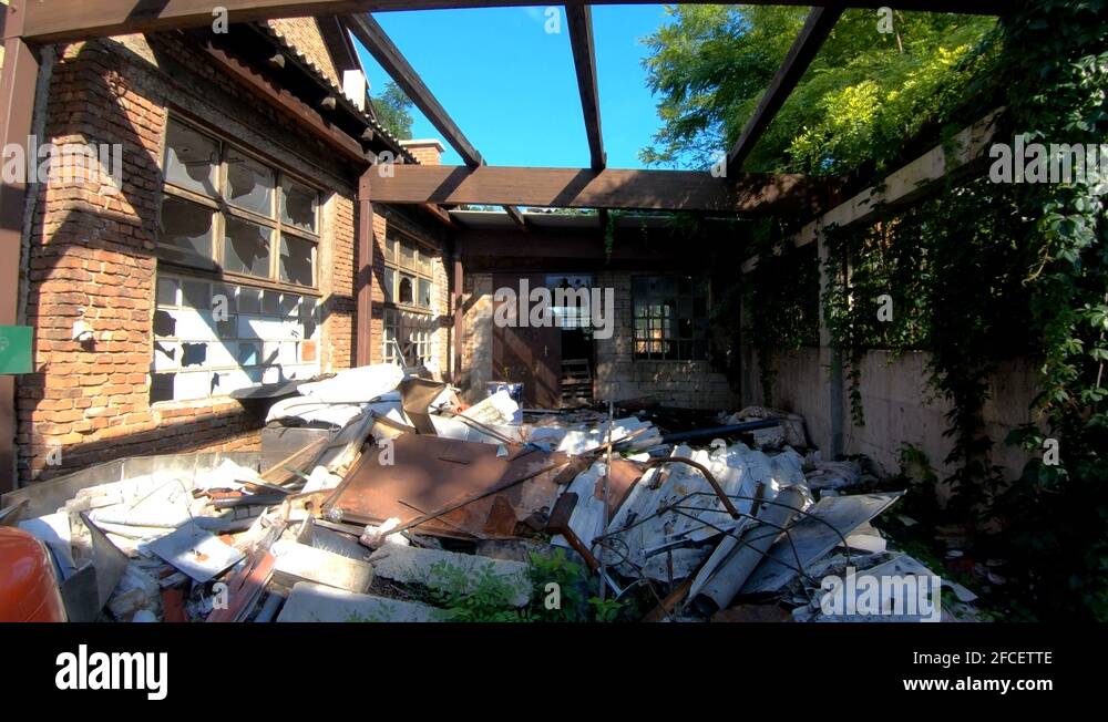 4K Tilt up abandoned garbage filled dumping backyard Stock Video ...