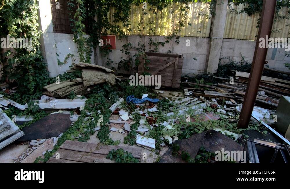 4K Forwarding right pan abandoned garbage filled dumping backyard Stock ...