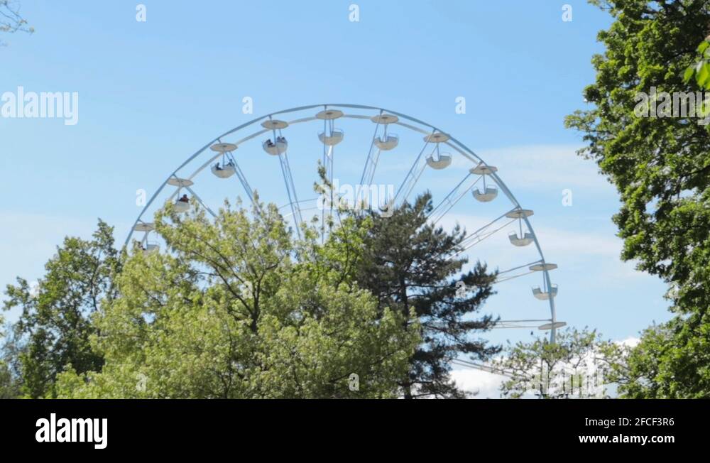 Ferris wheel behind trees Stock Videos & Footage - HD and 4K Video ...