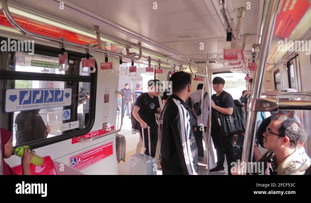 People get on a train at a subway station in Singapore Stock Video ...
