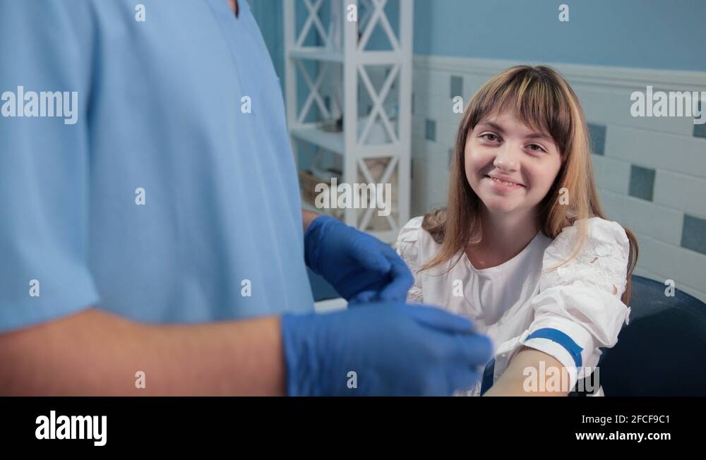 doctor makes an injection in the arm of a woman patient Stock Video ...
