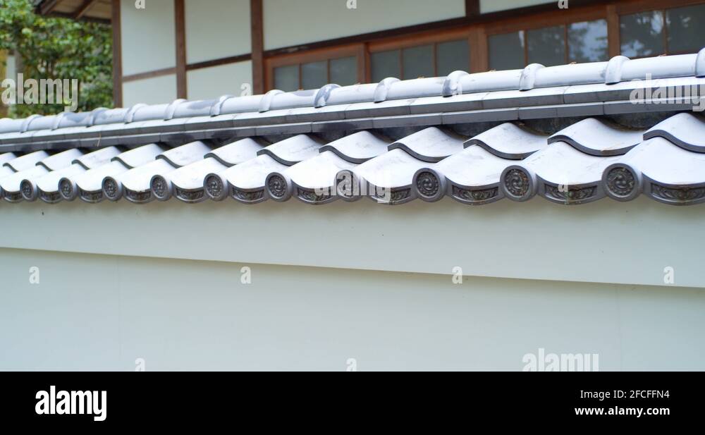 Smooth shot of the traditional Japanese rooftop palets in Kyoto, Japan ...