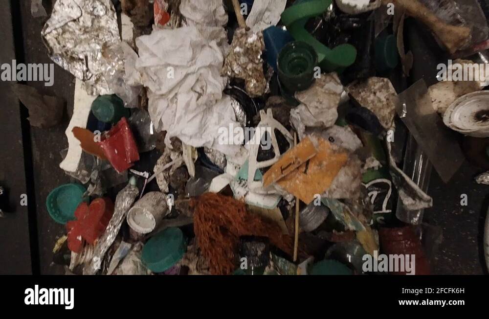 Conveyor belt filled with garbage at rubbish recycling factory. Sorting Stock Video Footage - Alamy