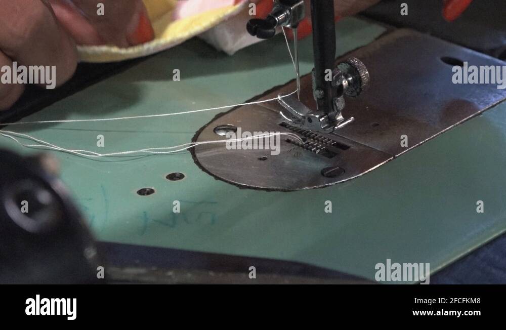 Adjusting Thread Before Sewing with a Sewing machine Stock Video ...