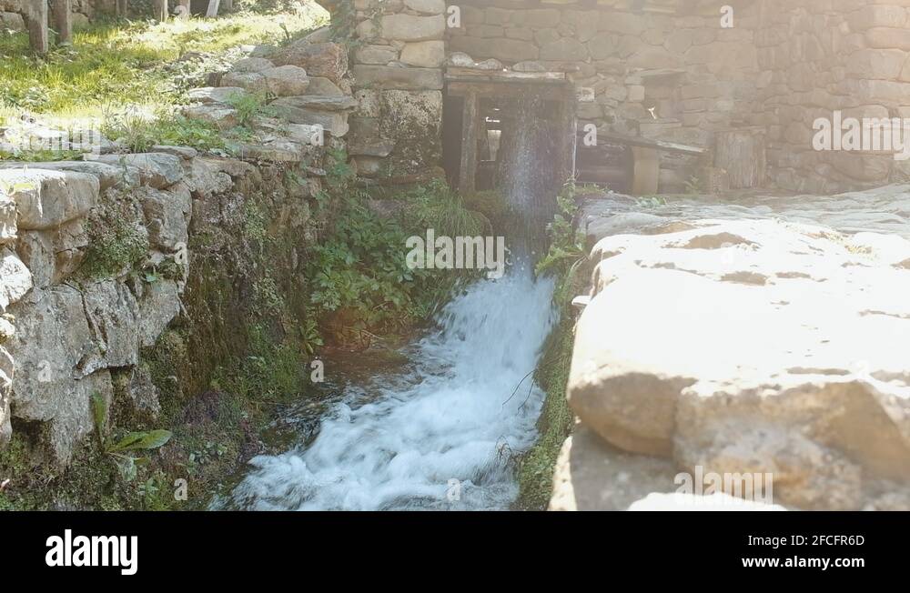 Gushing water from an old water driven mill. Using the power of water ...