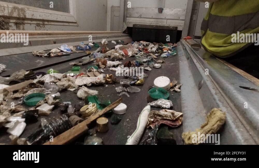 Conveyor belt filled with garbage at rubbish recycling factory. Sorting Stock Video Footage - Alamy