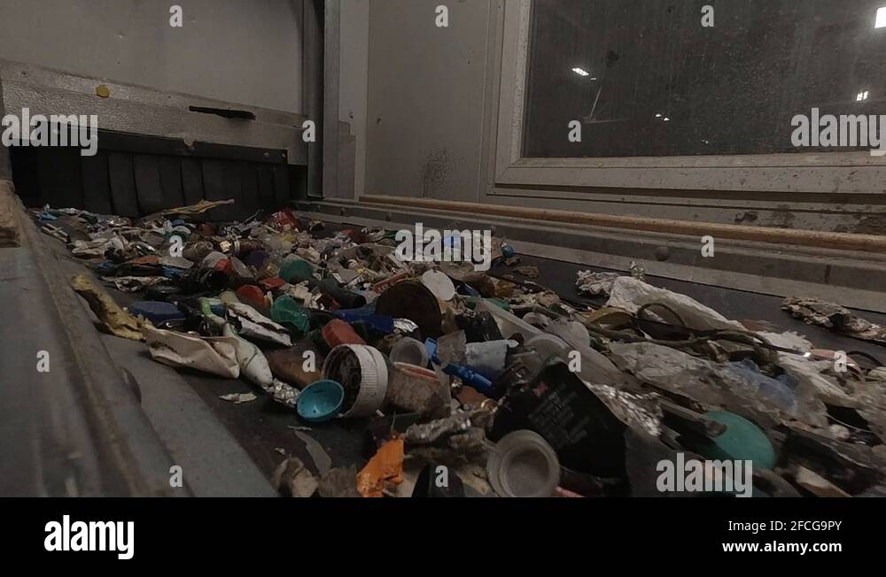 Conveyor belt filled with garbage at rubbish recycling factory. Sorting Stock Video Footage - Alamy