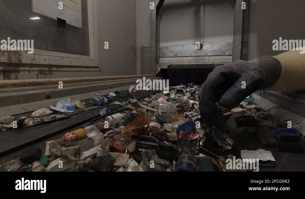Conveyor belt filled with garbage at rubbish recycling factory. Sorting Stock Video Footage - Alamy