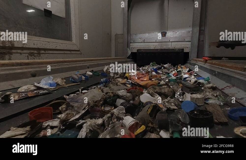 Conveyor belt filled with garbage at rubbish recycling factory. Sorting Stock Video Footage - Alamy