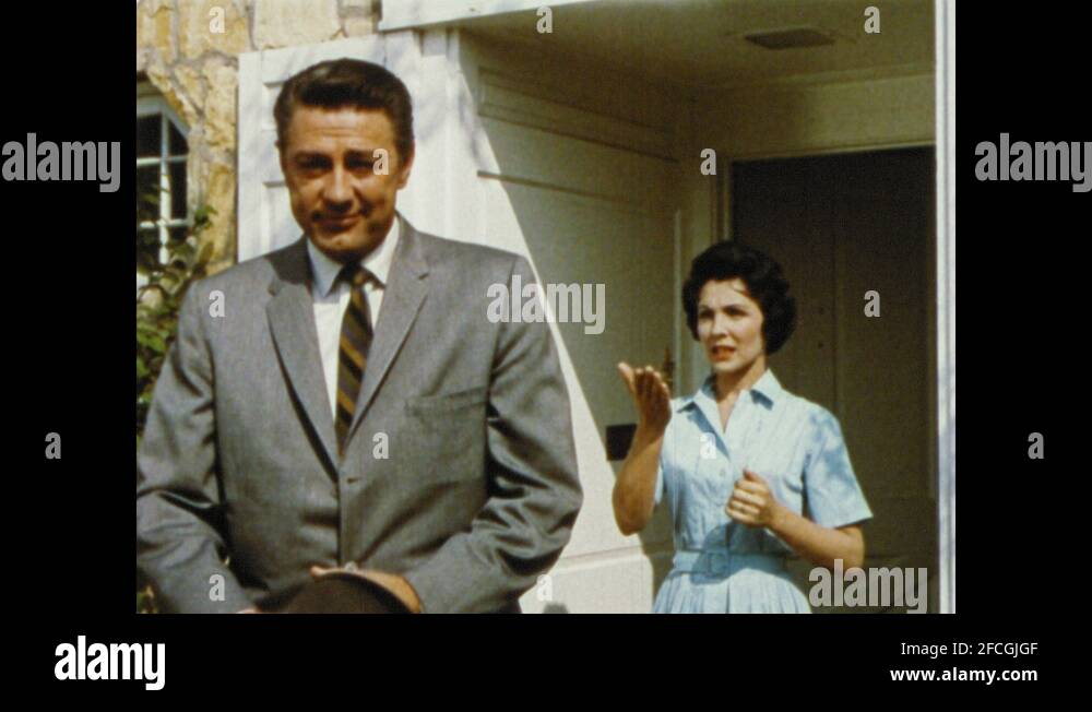 1950s: UNITED STATES: man gives wallet to wife. Man leaves for work ...