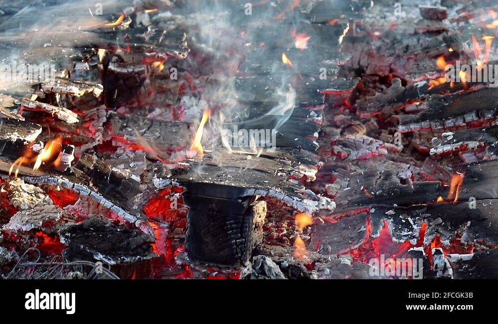 Slow Panning around end of Charred and Burnt Pallet Crumbling from Heat ...
