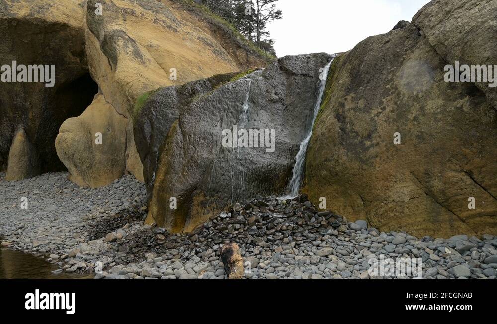 Waterfall at Hug Point at the Oregon Coast, State Park near Cannon ...