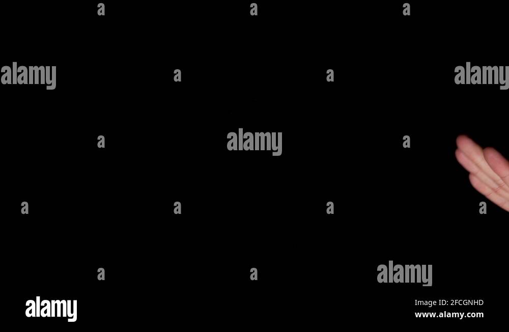 A hand mimicking an animaling across the screen. Another hand comes ...