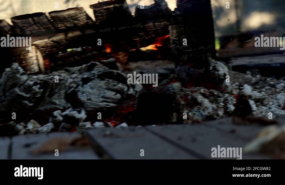 Slow Panning around end of Charred and Burnt Pallet to Close-Up of ...