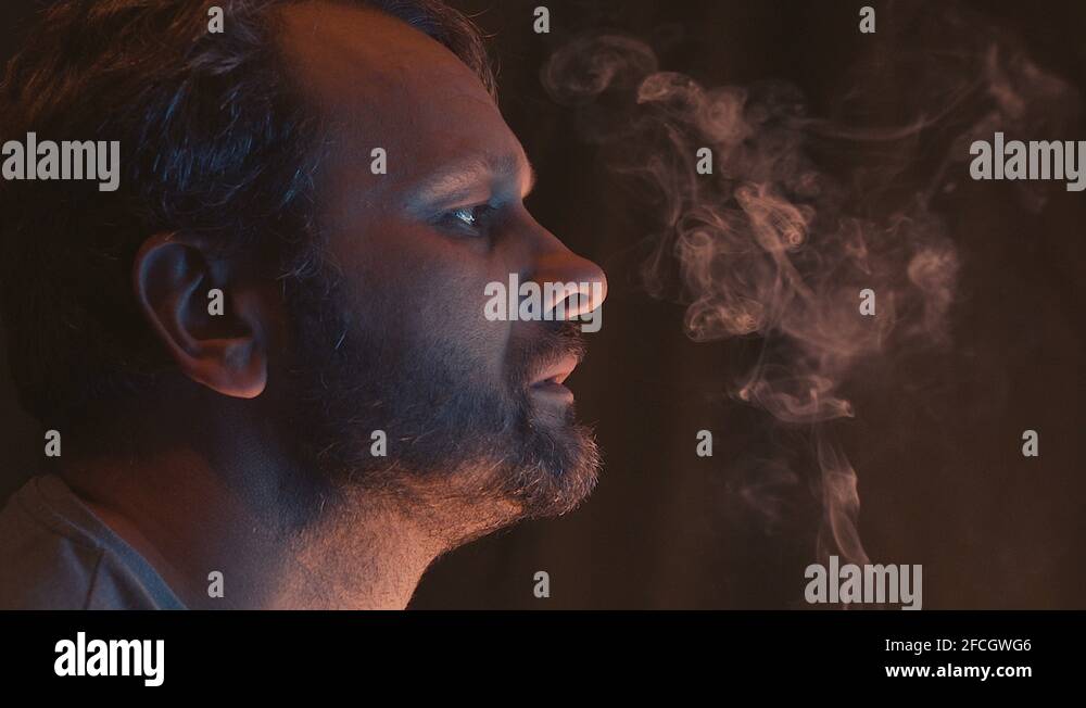 Neo-noir Full Head Face Young Man Smoking indoor cigarette smog with ...