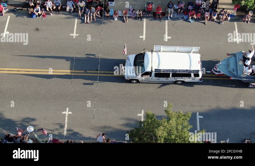 US Navy Veterans in ship float wave to parade observers, military ...