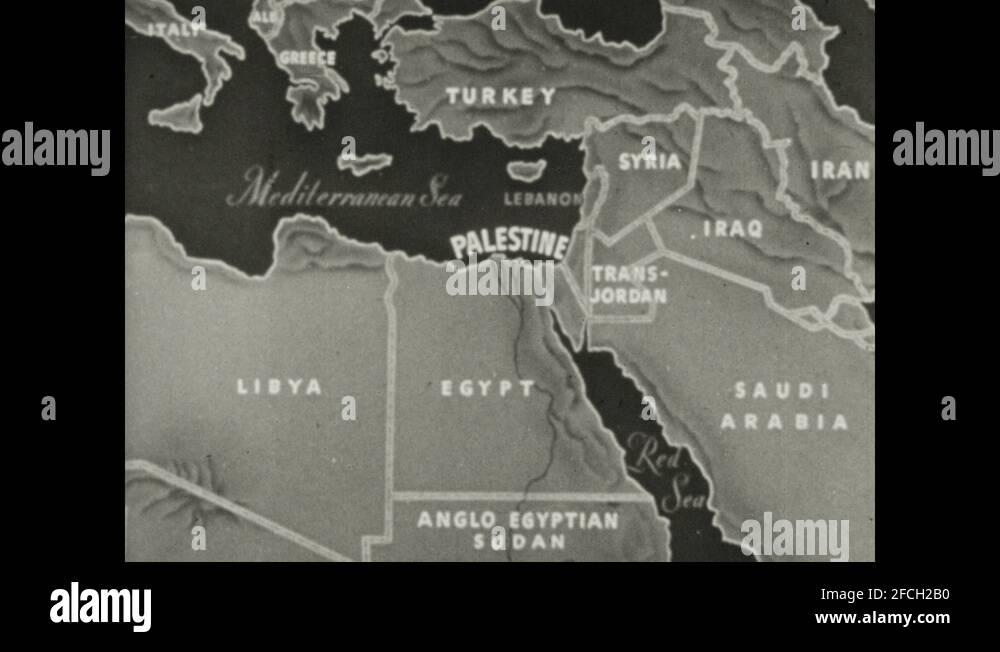 1950s: Map of middle east. People walk out of building. Plaque for ...