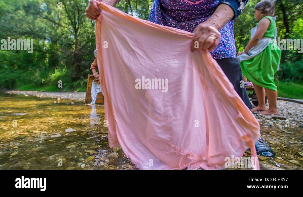 Older women are still washing clothes in the river Stock Video Footage ...