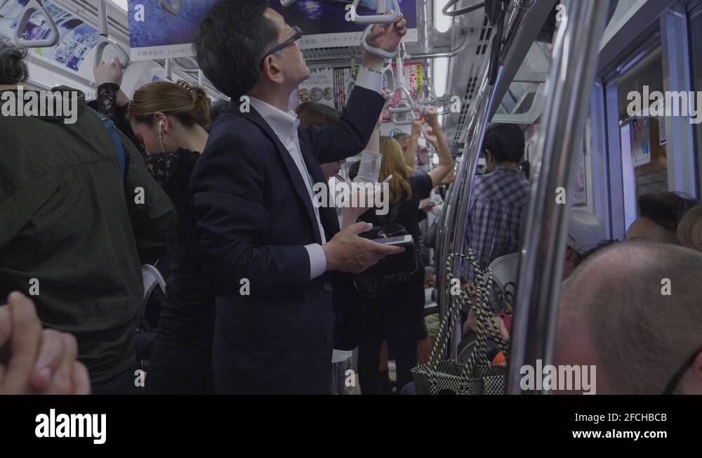 Standing crowd transportation rush hour subway train travel Stock ...
