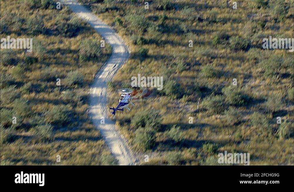 Tourist helicopters landing in the bush of the Okavango Delta in ...