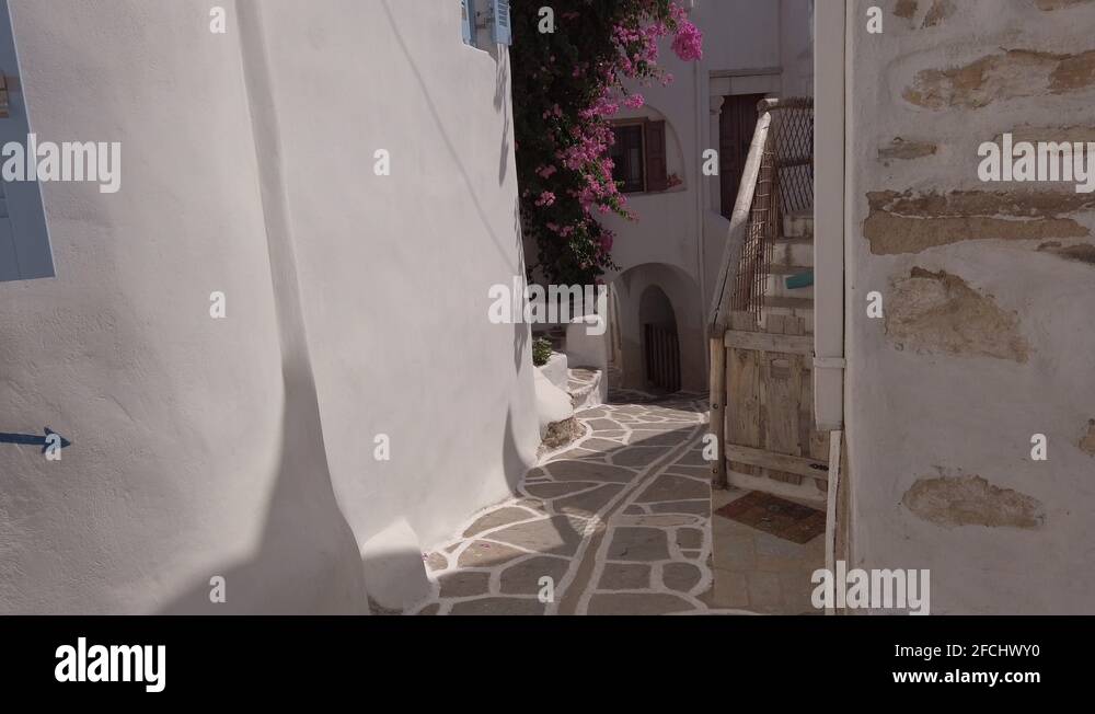 Walking view of Marpissa traditional village houses. Greek island Paros ...