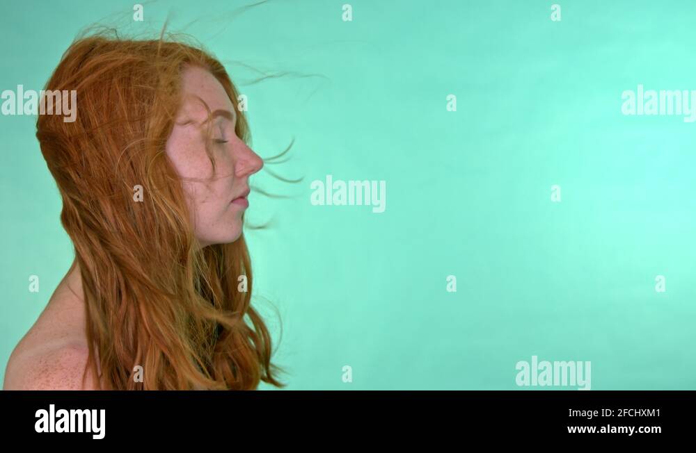 Profile of red-haired young girl, hair blowing. Green Screen Stock ...
