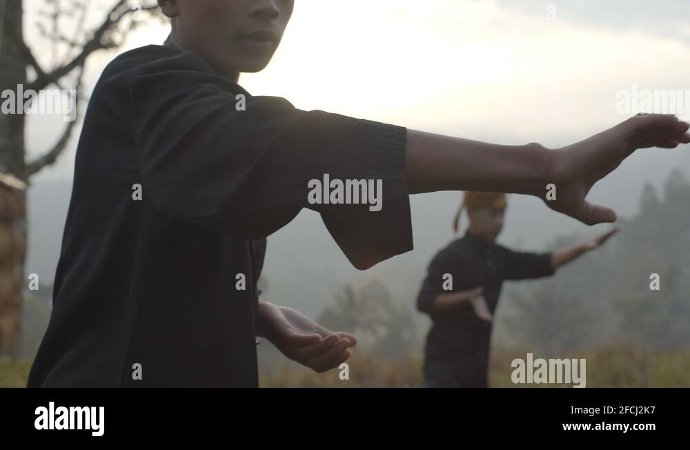 two boys choreograph in Pencak Silat style, traditional martial arts ...