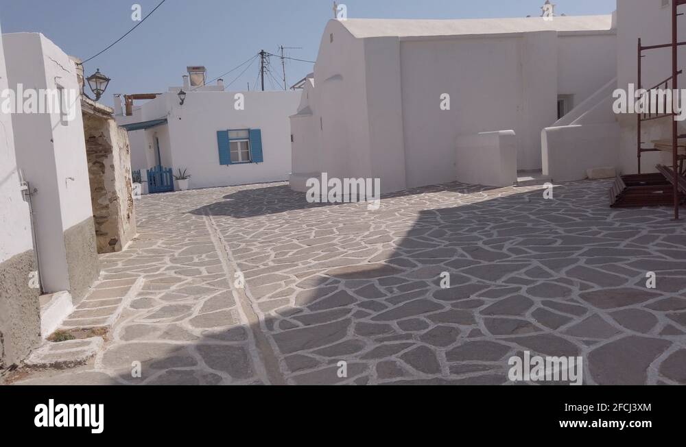 Walking view of Marpissa traditional village houses. Greek island Paros ...
