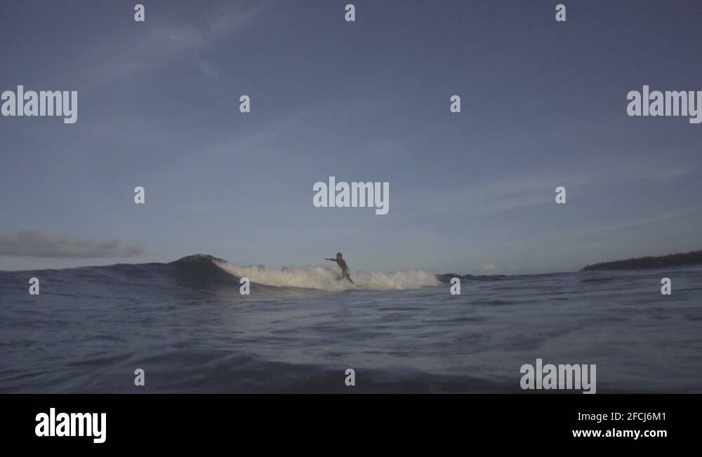 Asian Filipino Surfers Enjoying Small Waves In Gloomy Weather Stock ...