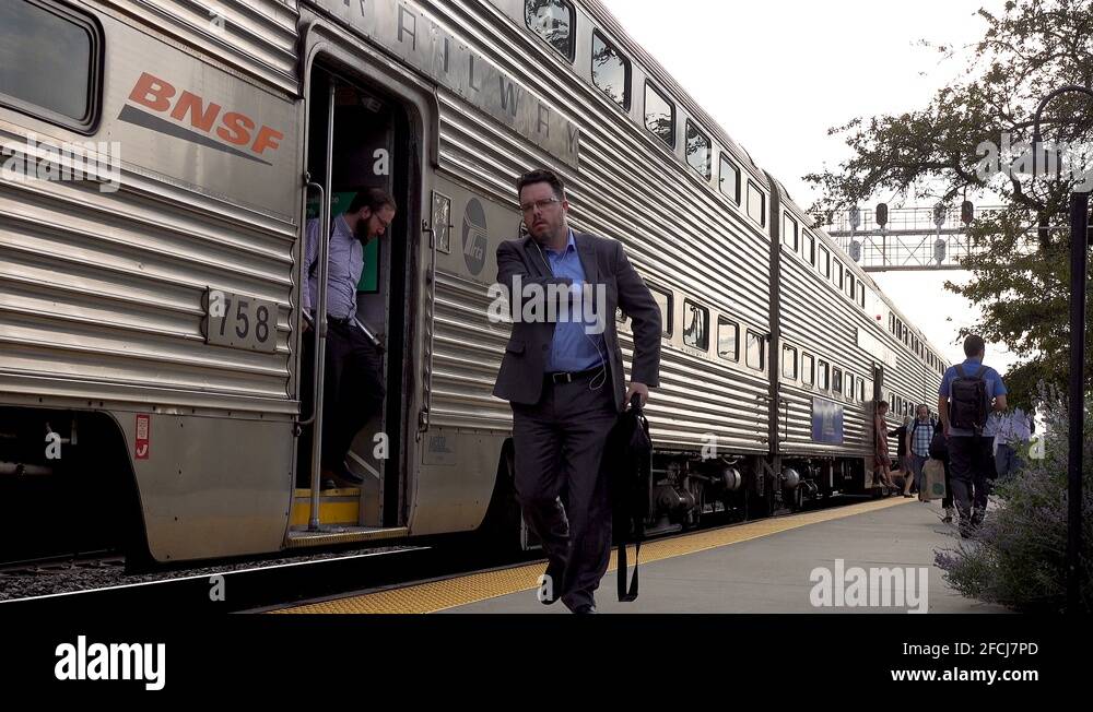 passengers getting off a commuter train and walking 4k Stock Video ...