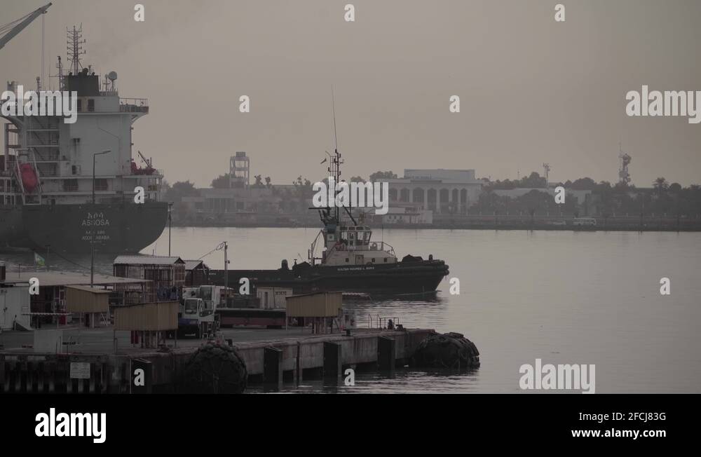 Tugboat service during harbour entrance Stock Video Footage - Alamy