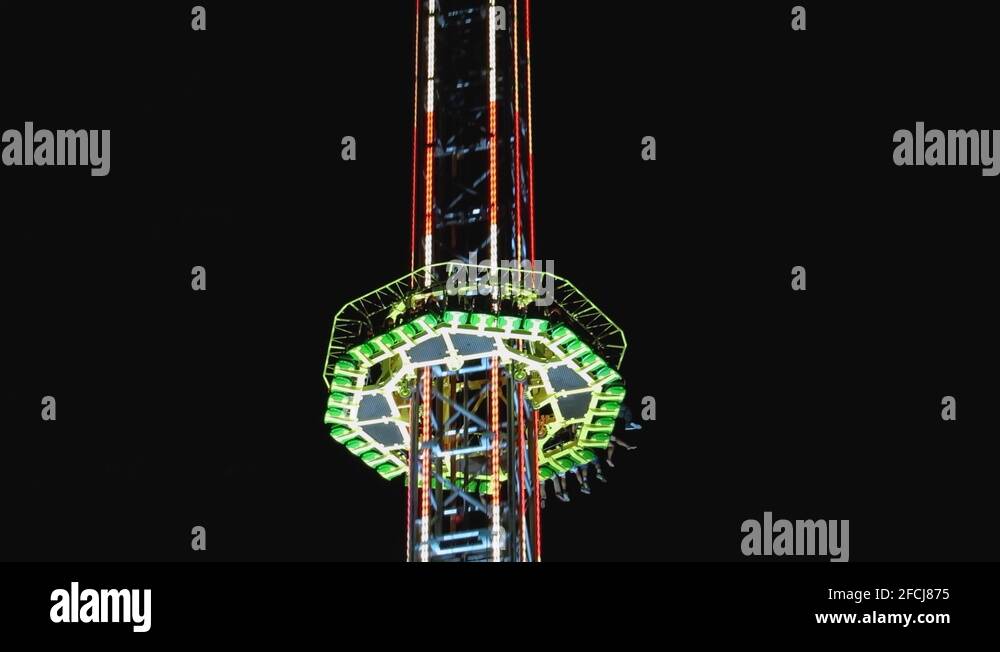 Festival Guests are Riding in a Tall Free Fall Tower Attraction at the ...
