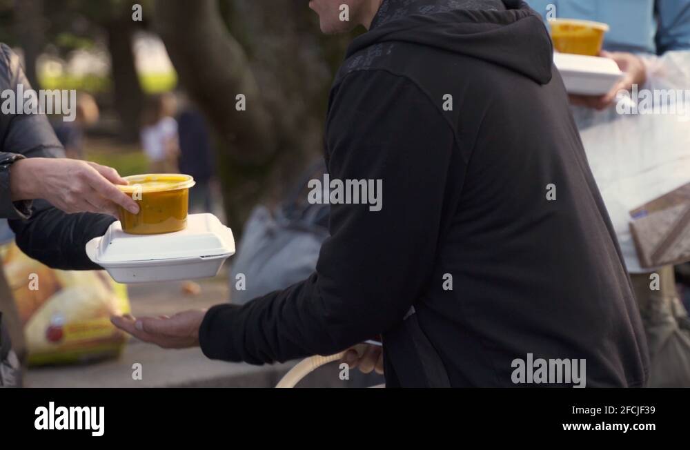 Man giving charity Stock Videos & Footage - HD and 4K Video Clips - Alamy