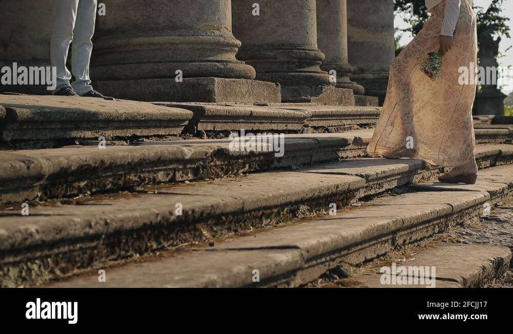 Woman steps columns Stock Videos & Footage - HD and 4K Video Clips - Alamy