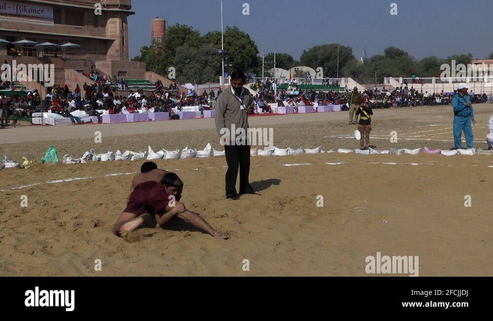 Indian Men Wrestling (Pehlwani) In Competition In Front Of Crowd, India ...