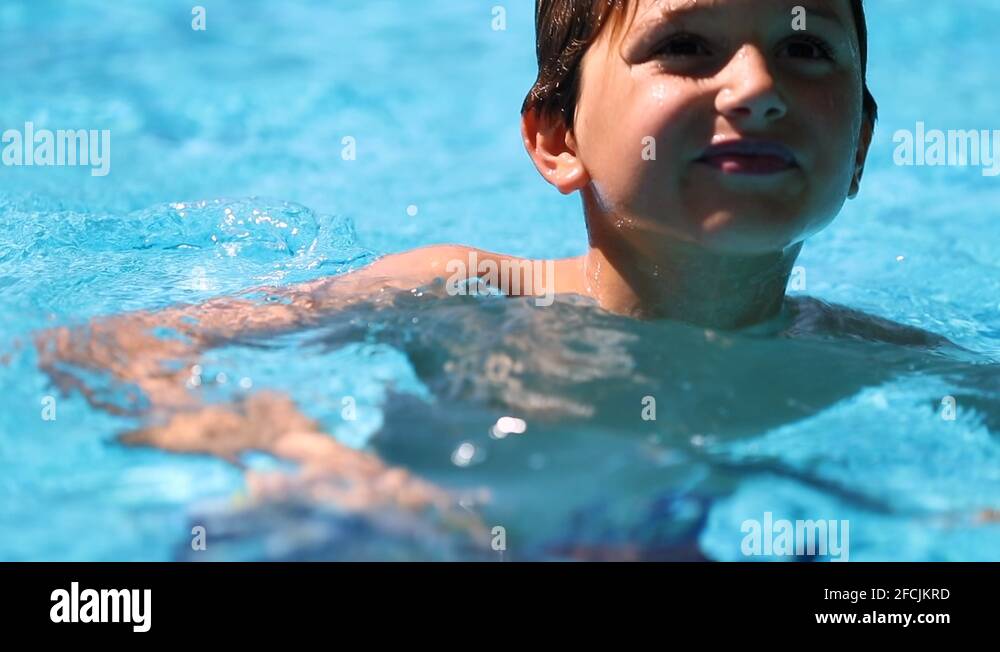 Young boy at the swimming pool water, candid child at the pool Stock ...
