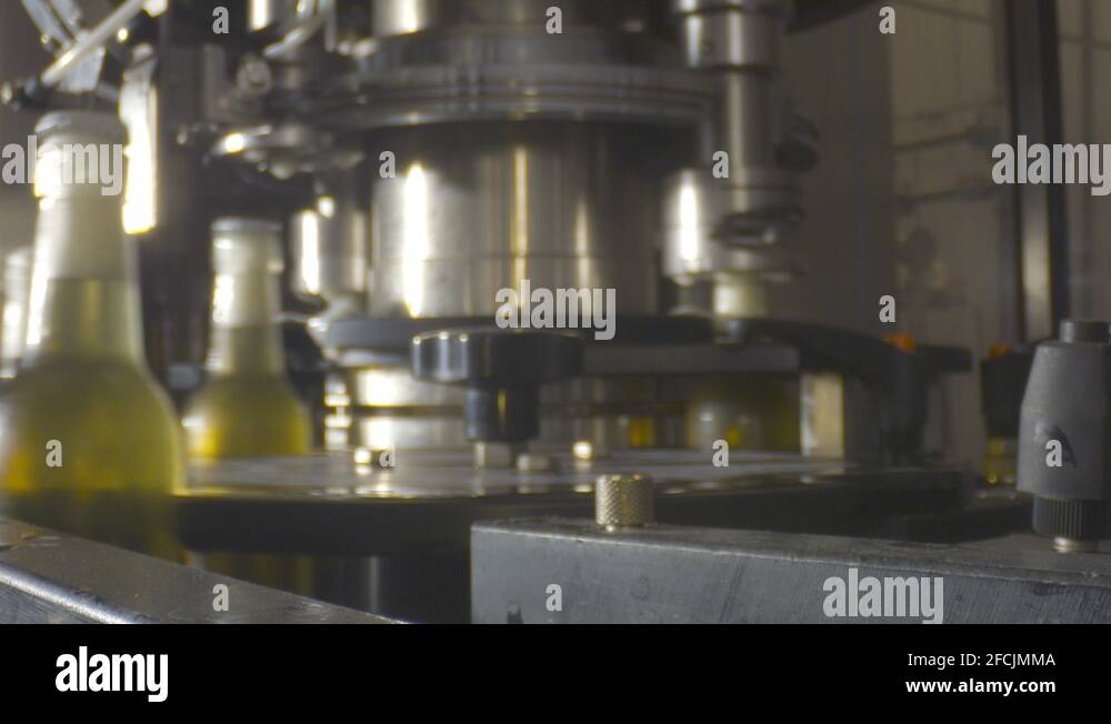 Beer factory process with glass bottles and automated machinery Stock ...