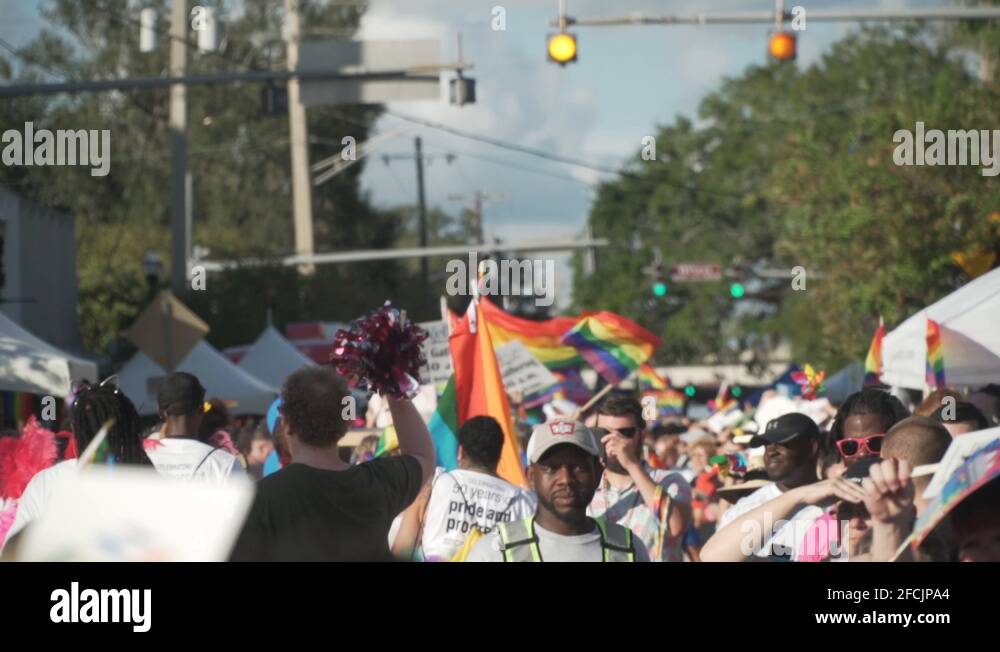 People Marching in Street With Pride Flags at River City Pride Parade ...