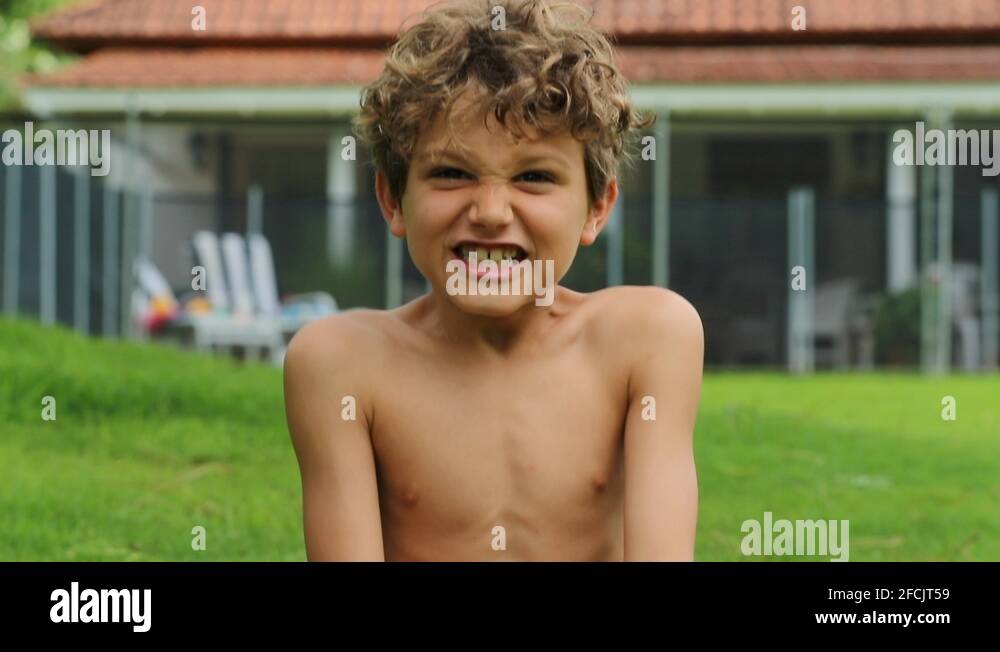 Portrait of young boy yelling roaring from top of his lungs Stock Video ...