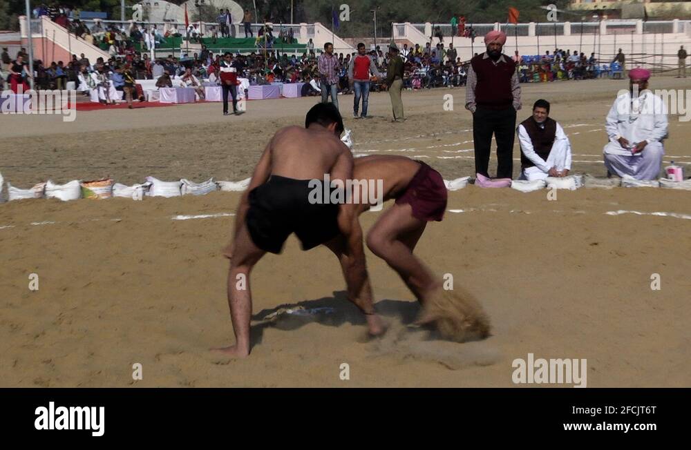 Pehlwani Match Taking Place Between Two Indian Men In Front Of Crowd ...