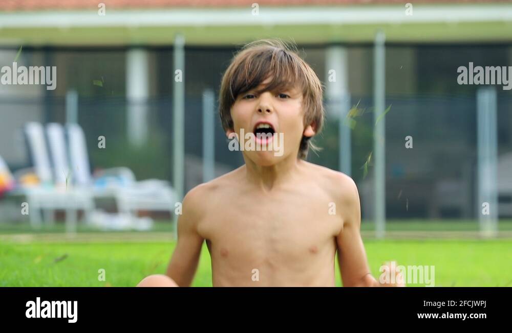 Young boy screaming from the top of his lungs in slow-motion. Child ...