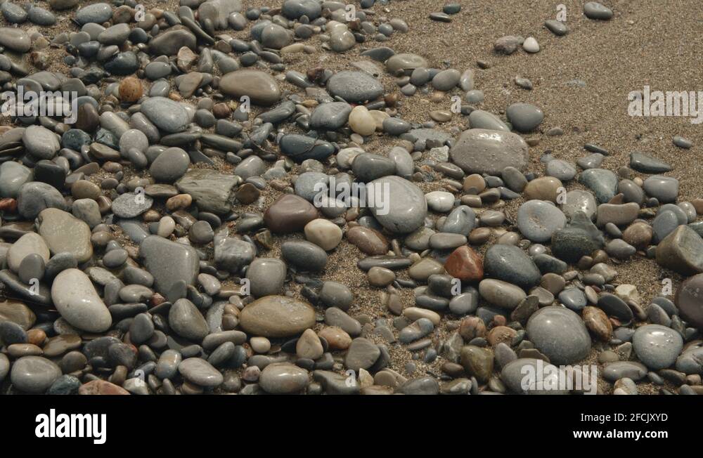 Pebbles in sand Stock Videos & Footage - HD and 4K Video Clips - Alamy