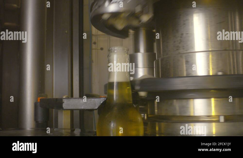 Beer factory process with glass bottles and automated machinery Stock ...