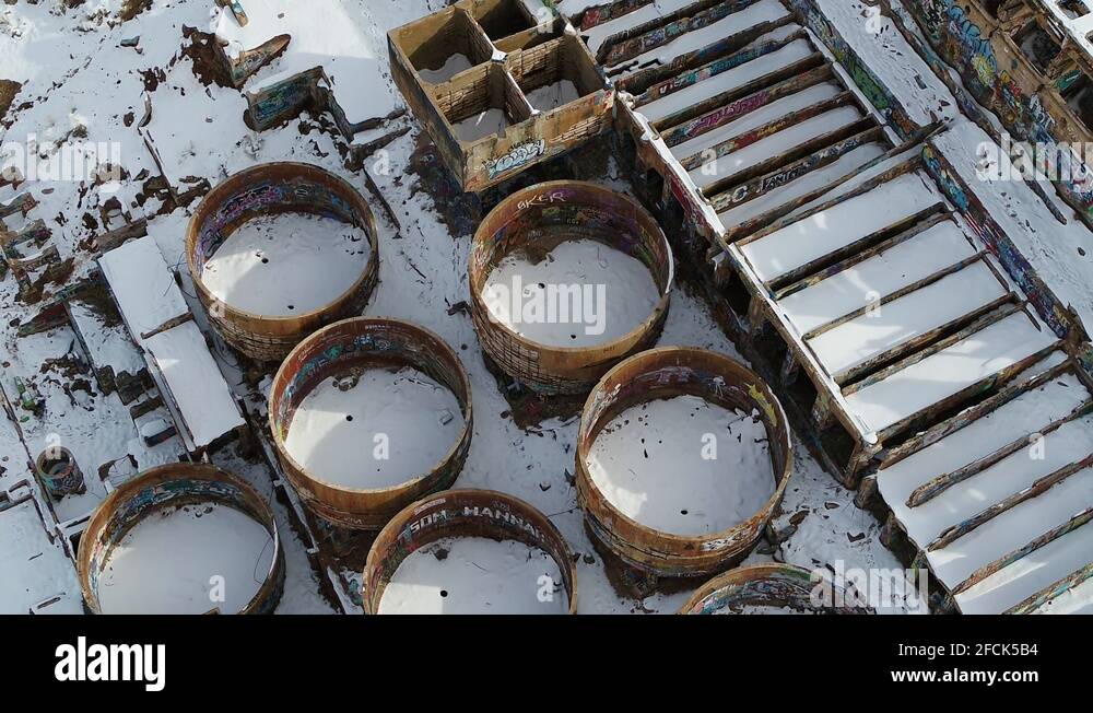A drone shot directly overhead, captures the water and leaching tanks ...