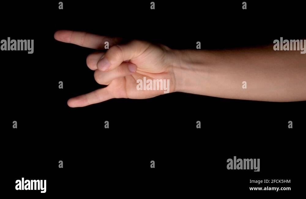 Horizontal rock music hand devil sign on a chroma key black screen ...