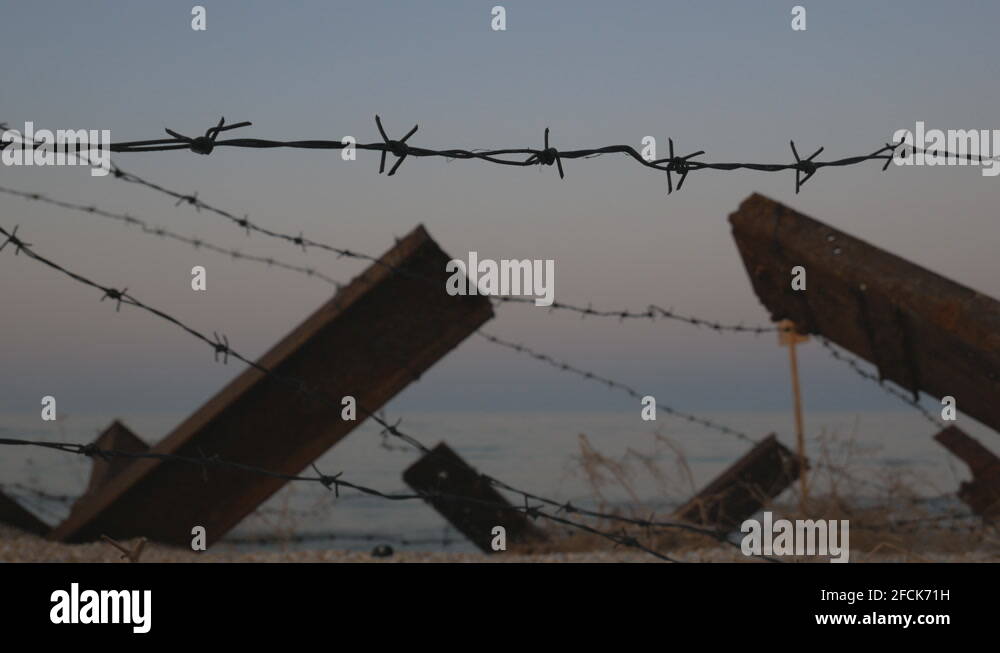 Barbed wire barriers Stock Videos & Footage - HD and 4K Video Clips - Alamy