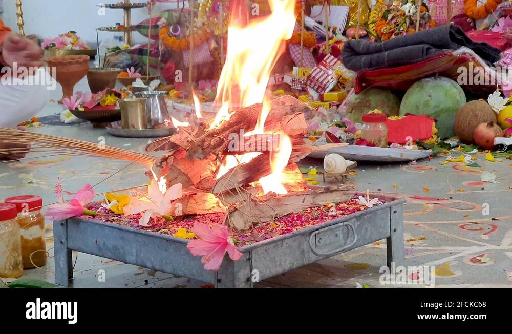 yajna, a ritual done in hindu worship where wood is set on fire with ...